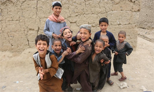 Children pictured at internally displaced persons camp in Kabul ...