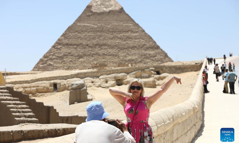 Thrifty tourists pile into Egypt as travel costs dive amid currency ...
