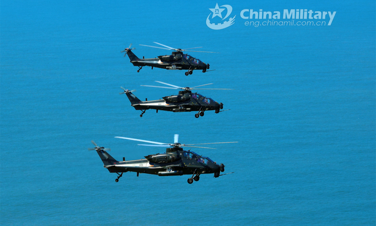 Attack helicopters fly over sea - Global Times