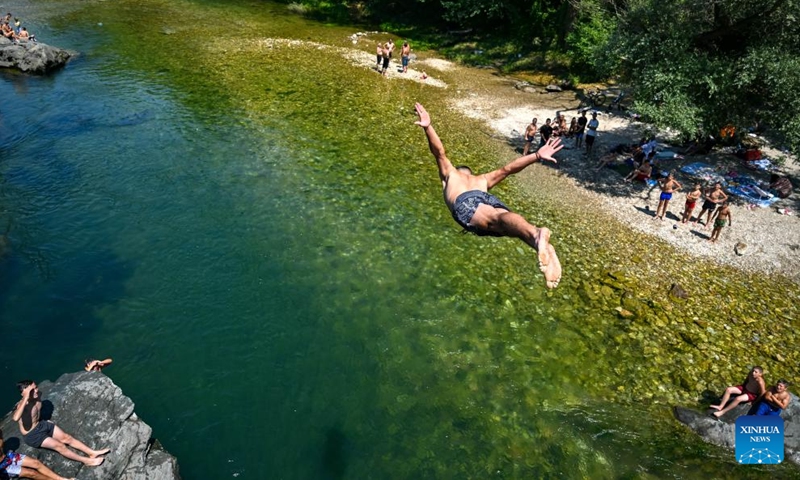 People dive at river Treska near Skopje, North Macedonia - Global Times