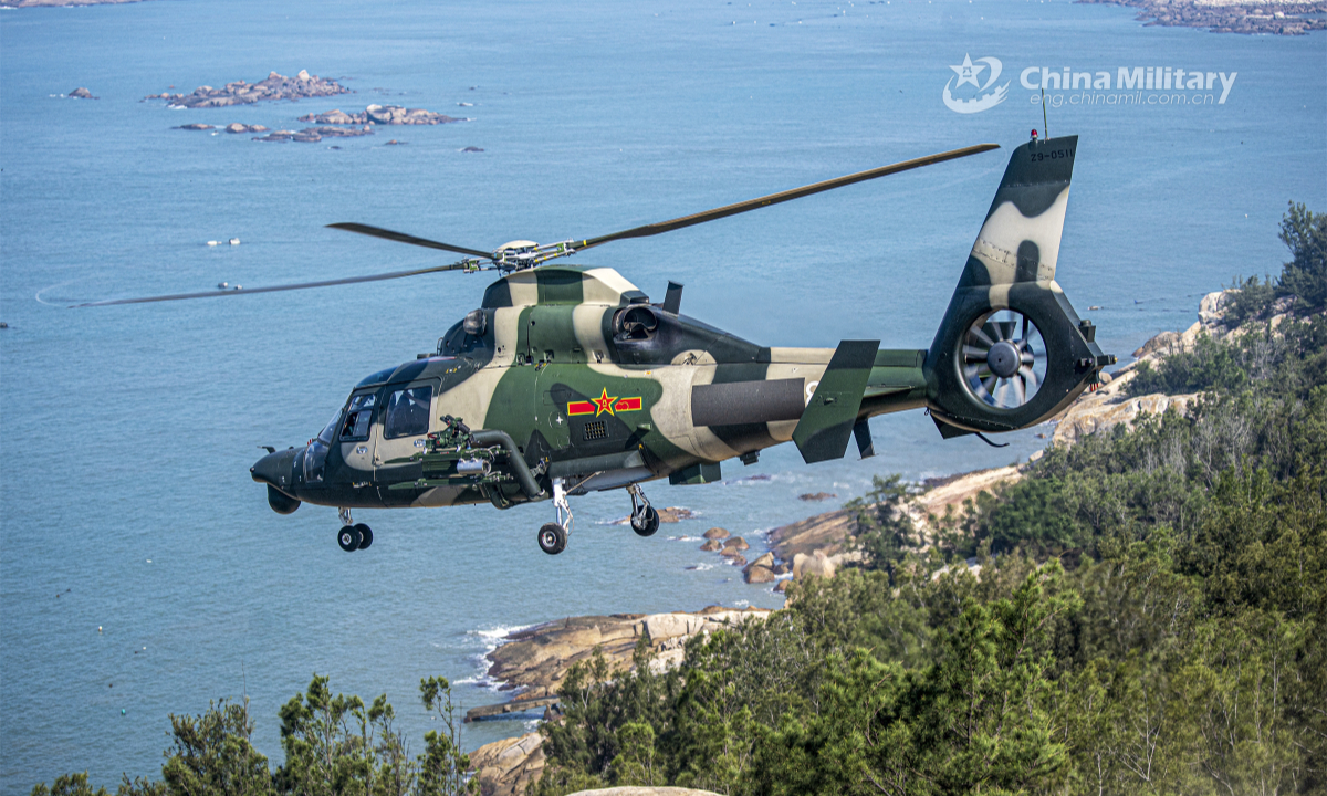 Attack helicopter flies over strait - Global Times
