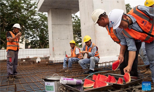 Chinese constructors work at construction site of Tel Aviv Light Rail ...
