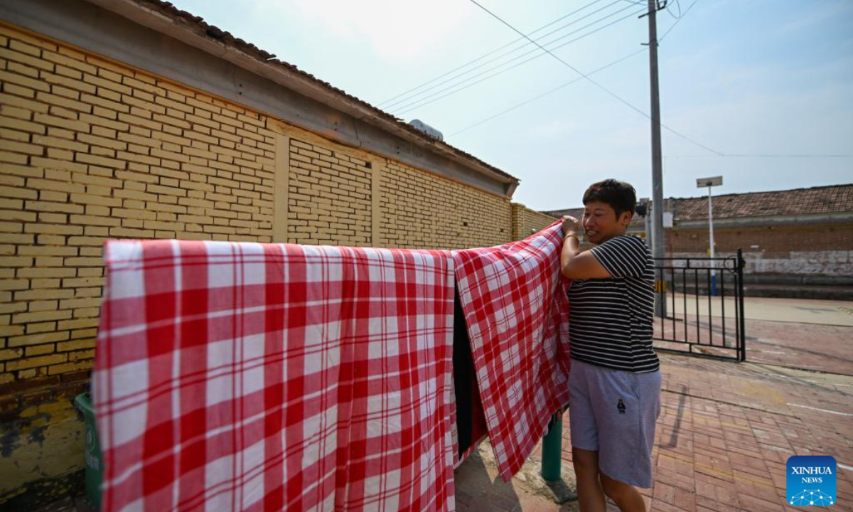 Flood-affected villagers return home in China's Tianjin - Global Times