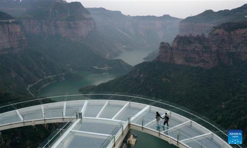 Tourists visit Baoquan scenic spot in Huixian, central China's Henan ...
