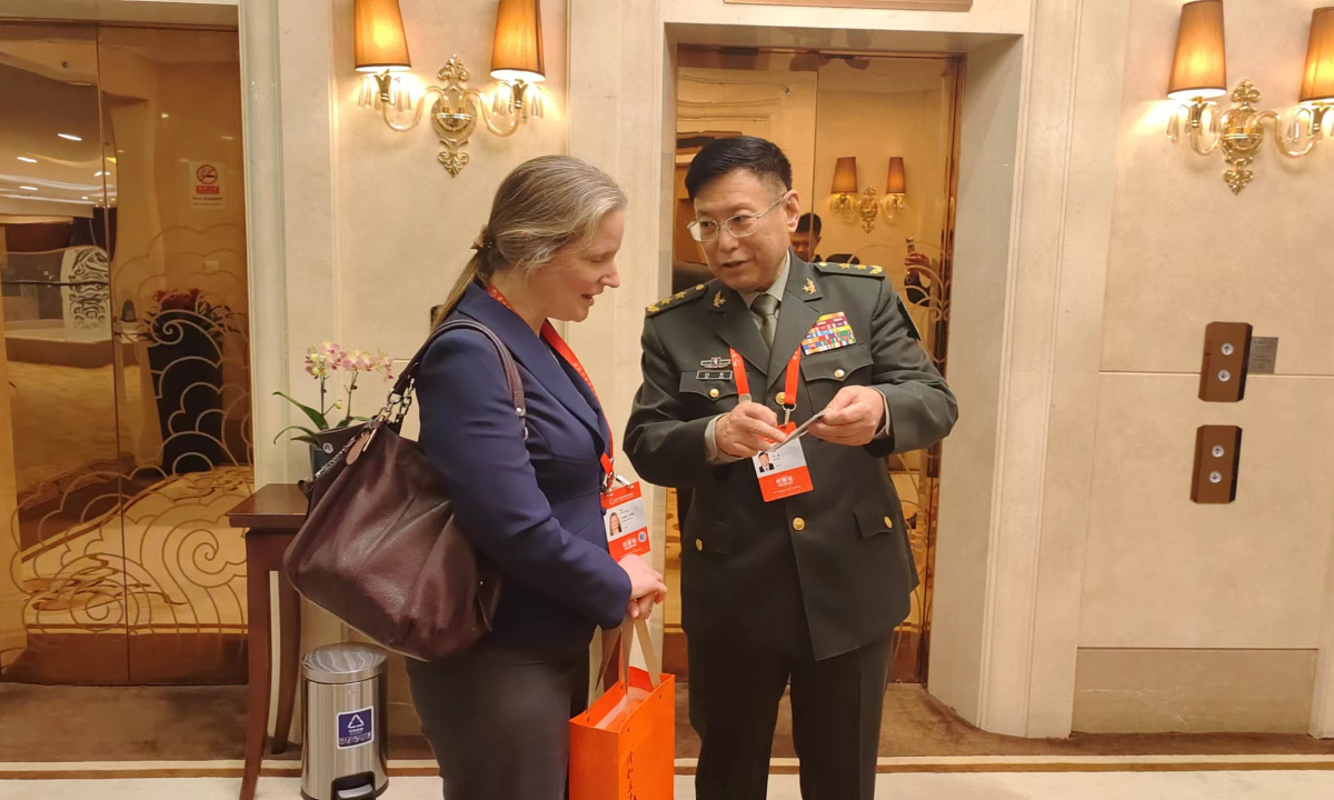 Lieutenant General He Lei gifts the armband of PLA Academy of Military ...