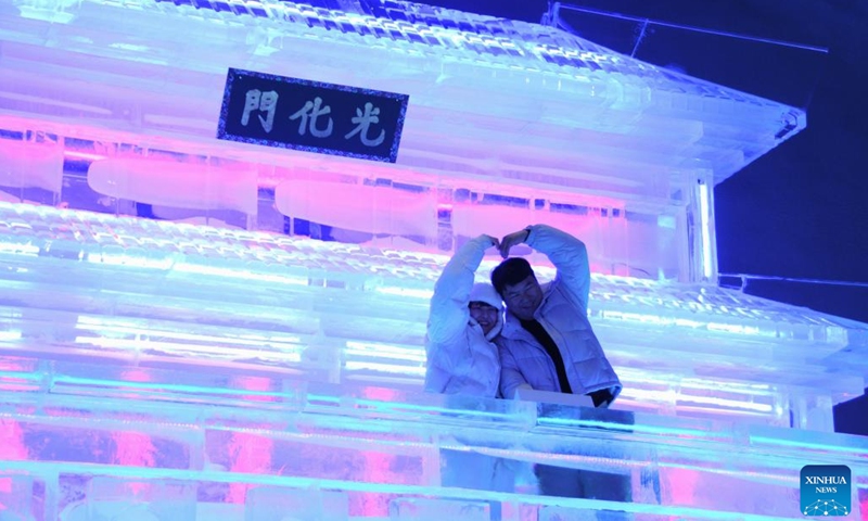 Tourists view ice statues made by Chinese ice sculptors in Gangwon ...