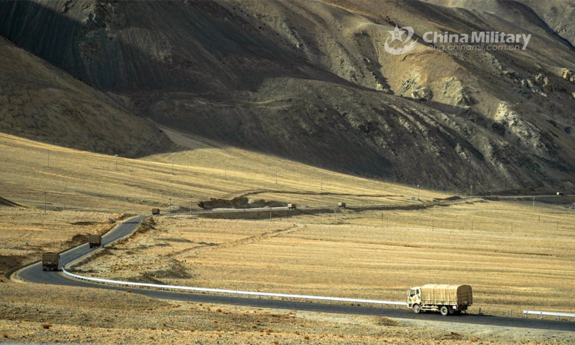 Military trucks drive to training field - Global Times