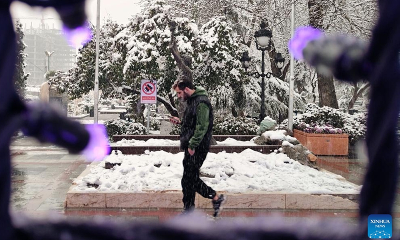People walk amid snow in Tehran, Iran - Global Times