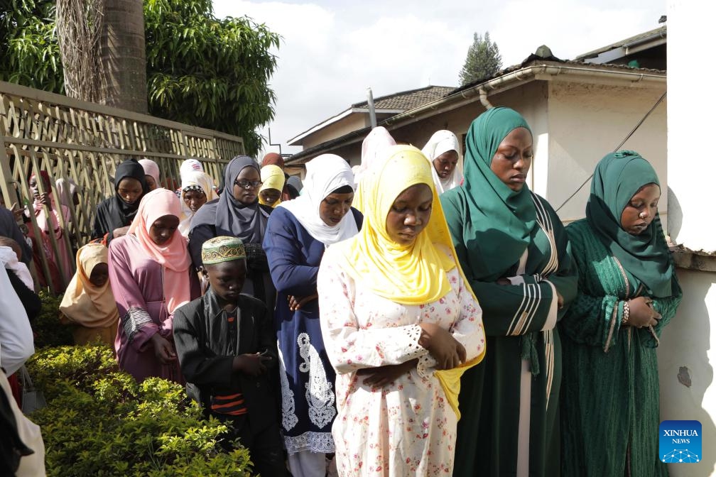 People perform Eid al-Fitr prayers at Uganda National Mosque in Kampala ...
