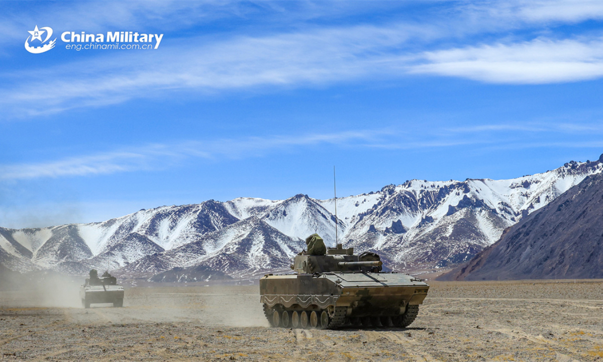 Armored vehicles rumble towards designated area - Global Times