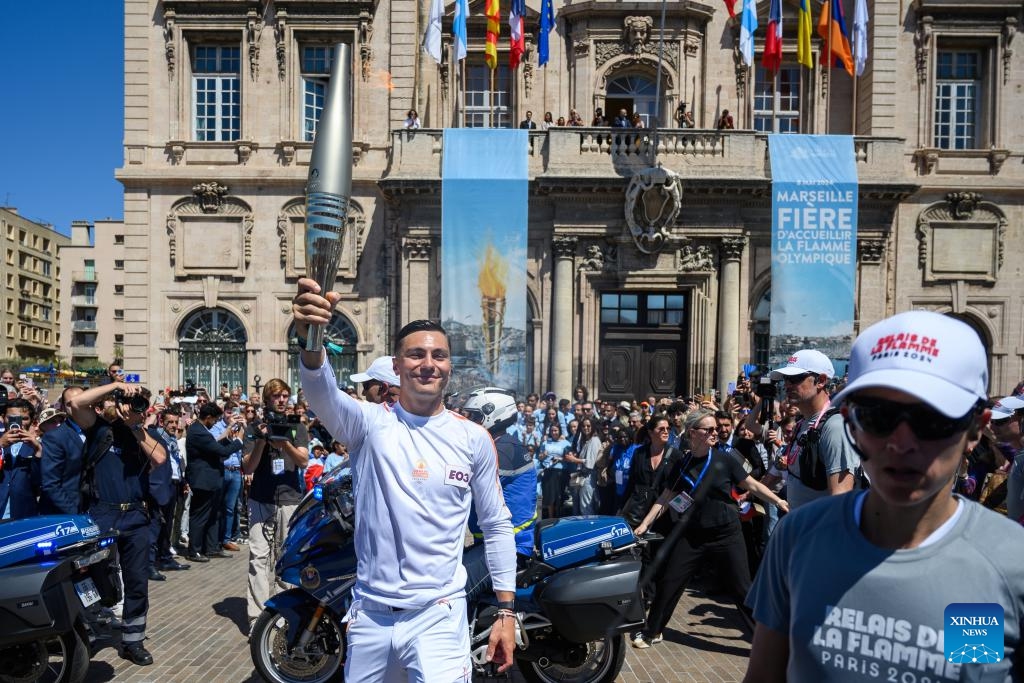 Relay of Olympic flame of Paris 2024 - Global Times