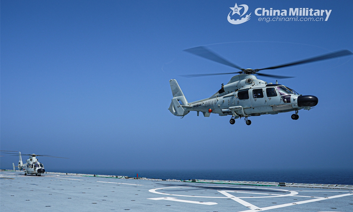 Chopper lifts off from landing ship - Global Times