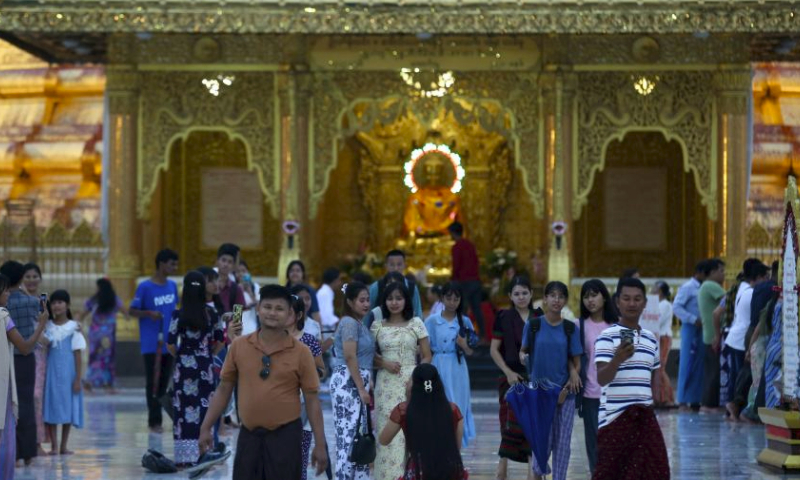 People visit Botahtaung Pagoda during celebrations of full moon day of ...