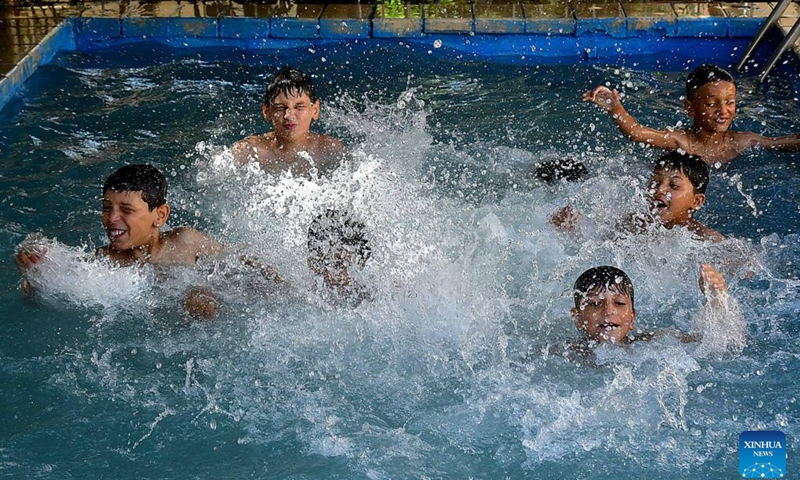 Children have fun in water during summer days in Syria - Global Times