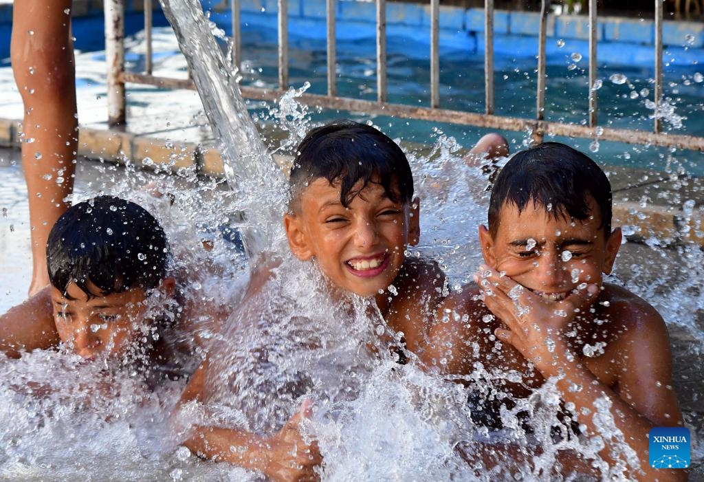 Children have fun in water during summer days in Syria - Global Times