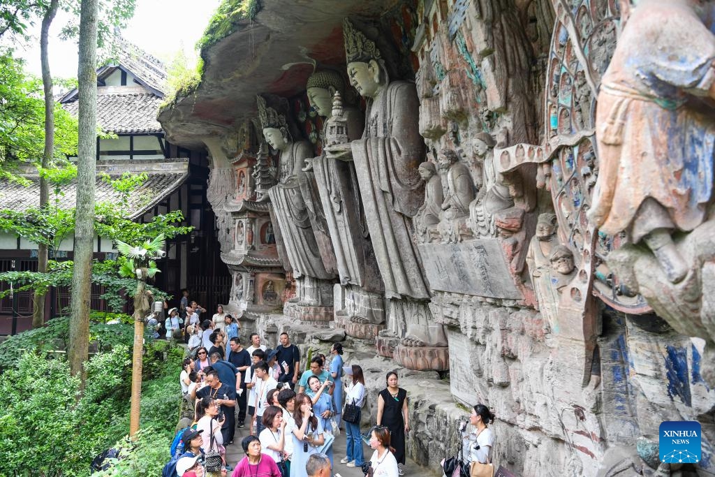 Tourists visit scenic spot of Dazu Rock Carvings in China's Chongqing ...