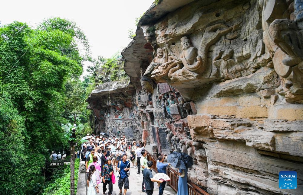 Tourists visit scenic spot of Dazu Rock Carvings in China's Chongqing ...