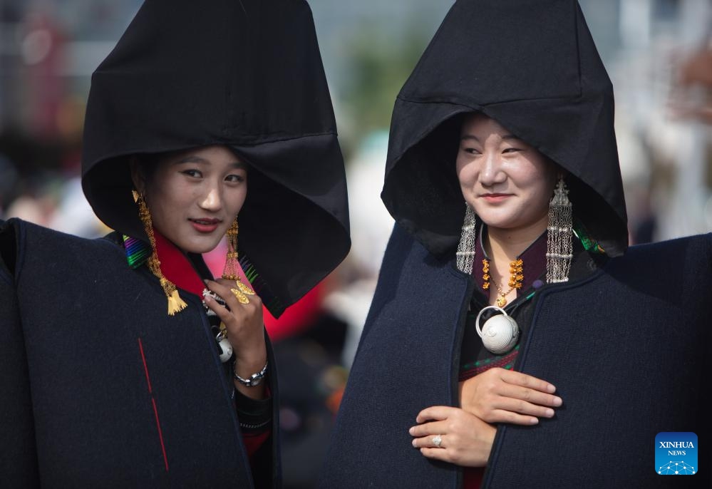 People dressed in traditional Yi costumes celebrate torch festival in China's Sichuan - Global Times