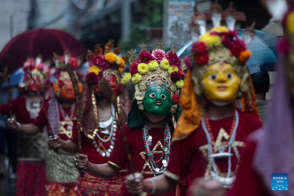 Masked dancers take part in parade in Kathmandu, Nepal - Global Times