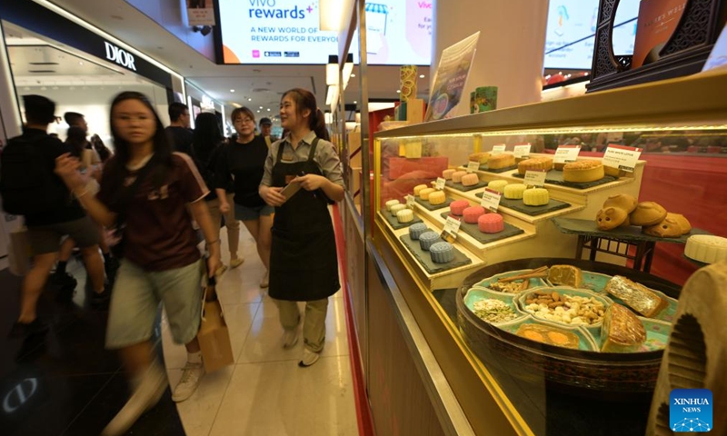 People select mooncakes ahead of Mid-Autumn Festival in Singapore ...