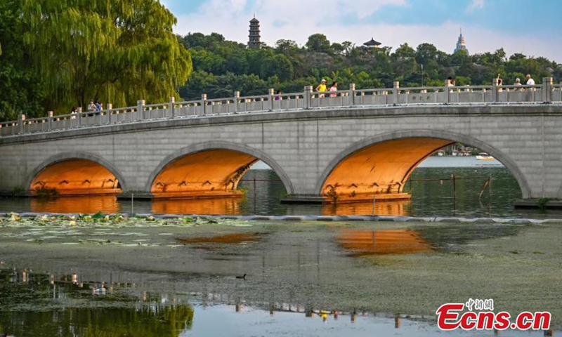 Golden sunlight shines through bridge arches in Nanjing - Global Times