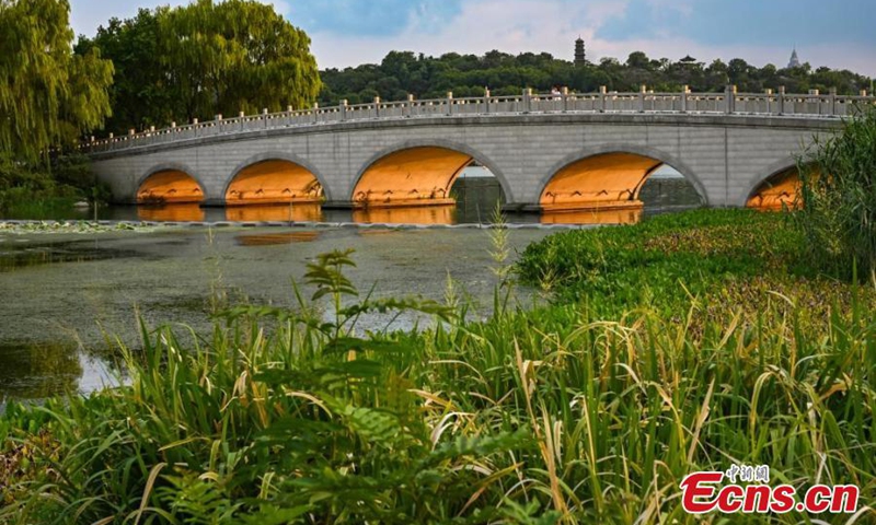 Golden sunlight shines through bridge arches in Nanjing - Global Times