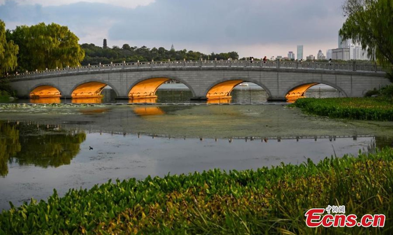 Golden sunlight shines through bridge arches in Nanjing - Global Times