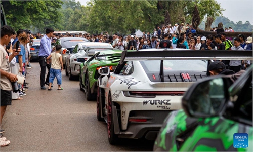 Large group of luxury cars displayed at Cambodia's famed Angkor ...