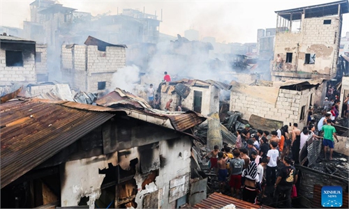 Residents return homes after fire at slum area in Manila - Global Times