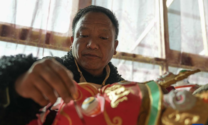 Inheritor of traditional Tibetan mask making technique in Xizang ...