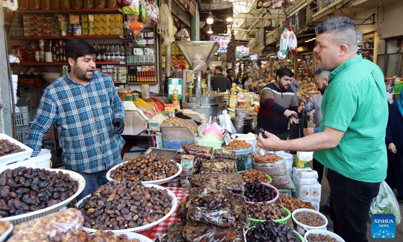People shop at market during holy month of Ramadan in Mosul, Iraq ...
