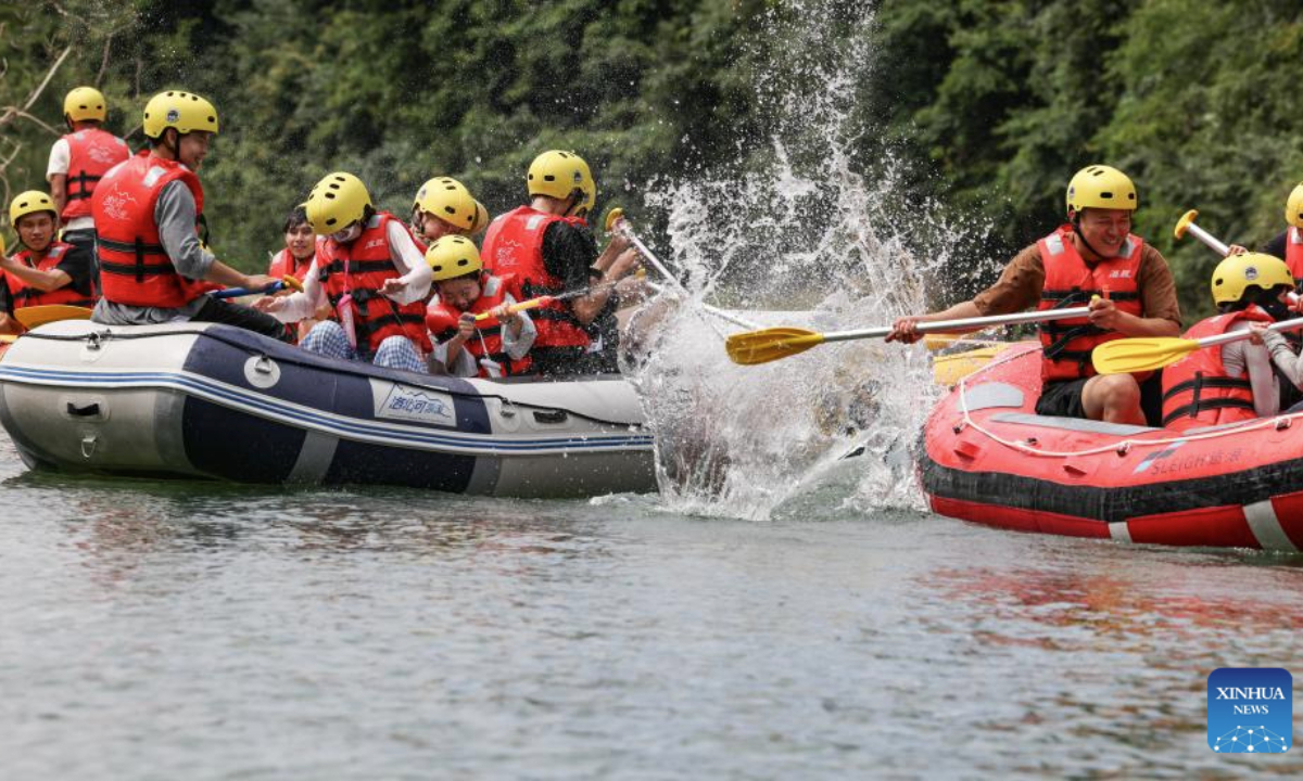 People raft in inflatable boats on Luobei River in Guizhou - Global Times